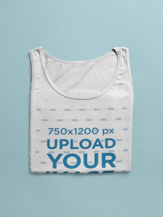Placeit - Mockup of a Folded Tank Top on a Solid Surface
