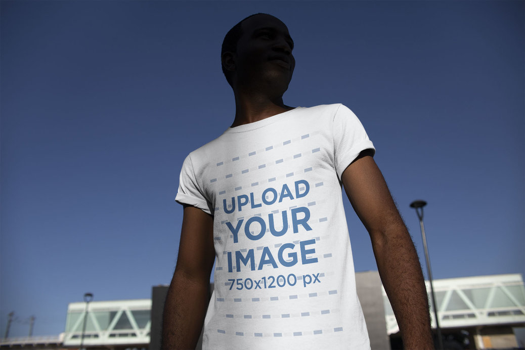 Placeit - T-Shirt Mockup Featuring a Man with His Face in a Shadow