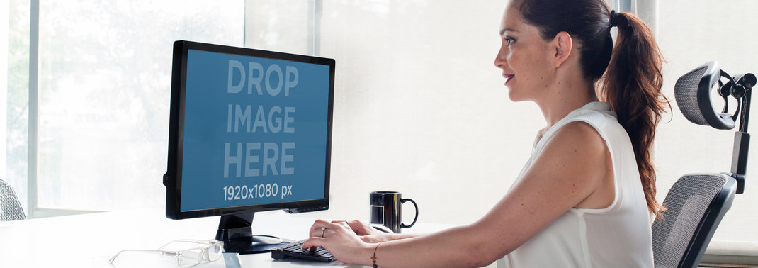 Placeit - Desktop PC Mockup Generator of a Pretty Lady at Work