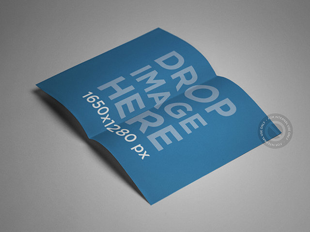 Placeit - Mockup Featuring a 2 Panel Brochure Lying Open Over a Smooth ...