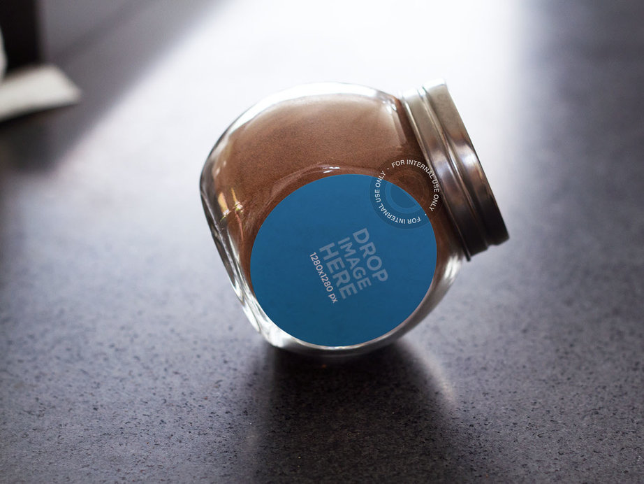 Placeit - Packaging Mockup of a Glass Container on Top of a Kitchen Counter
