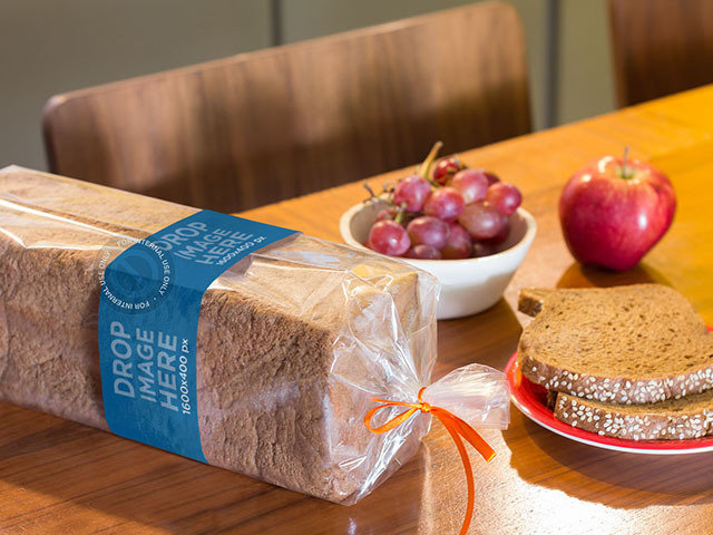 Placeit - Label Mockup of a Packaged Loaf of Bread on Top of a Table