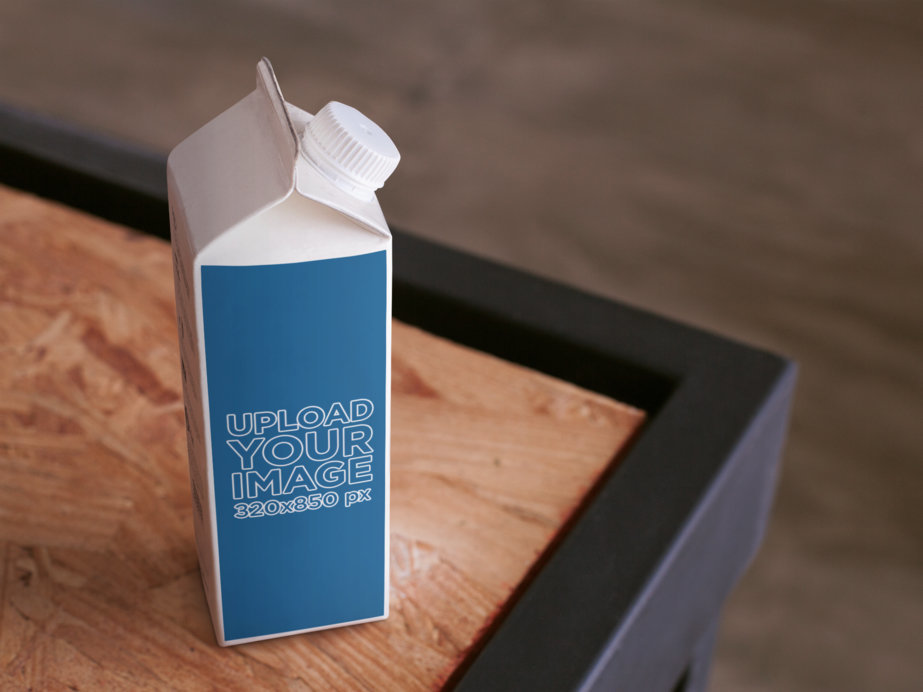 Placeit - Packaging Mockup of a Milk Carton Over a Wooden Table