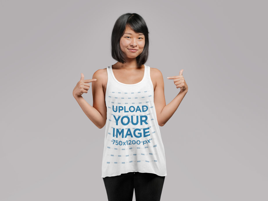 Placeit - Mockup of a Young Woman Pointing at Her Tank Top