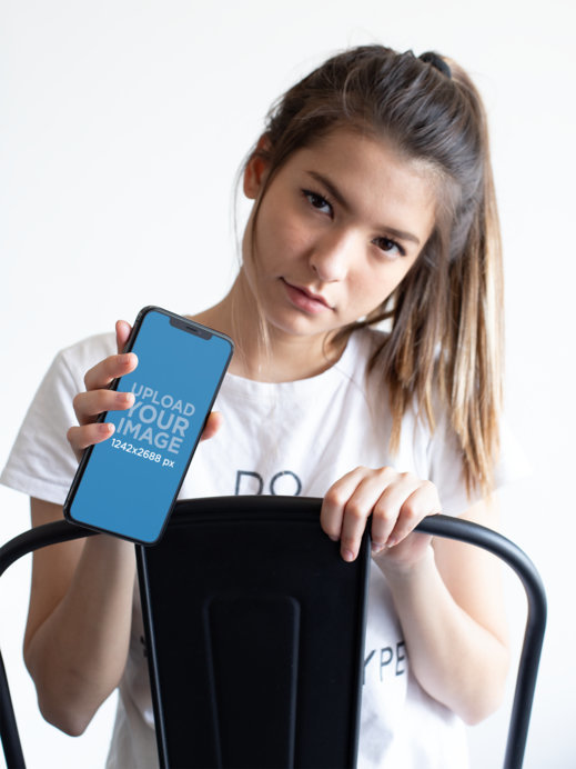 Placeit - iPhone 11 Pro Max Mockup Featuring a Woman Sitting Backwards ...