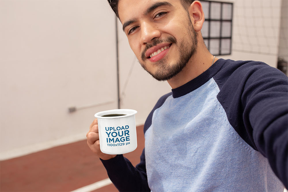 Placeit - 12 oz Enamel Mug Mockup Featuring a Man Taking a Selfie