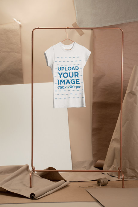 Placeit - Mockup of a Women's T-Shirt Hanging from a Clothing Rack in ...