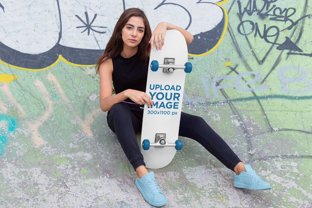 Placeit - Skateboard Mockup Featuring a Woman Sitting on a Skate Ramp