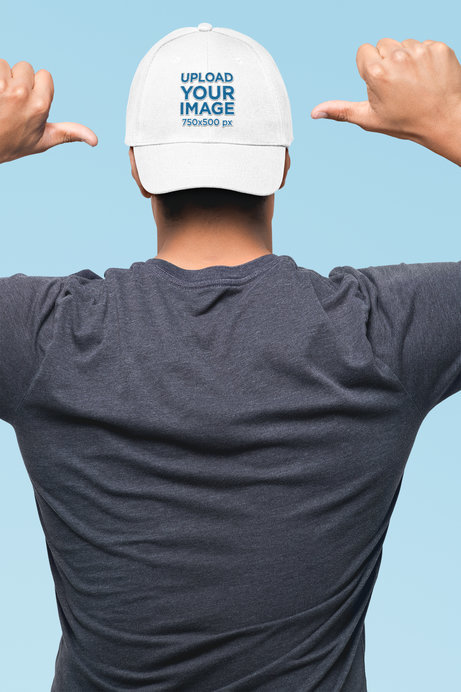 Placeit - Mockup of a Man Wearing a Dad Hat Backwards and Pointing at It