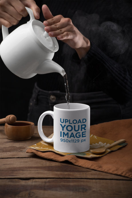 Placeit - Mockup of a Woman Pouring Hot Water in an 11 oz Mug