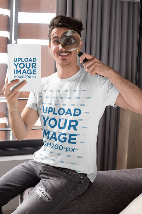 Placeit - T-Shirt Mockup of a Man Playing with a Magnifying Glass while ...