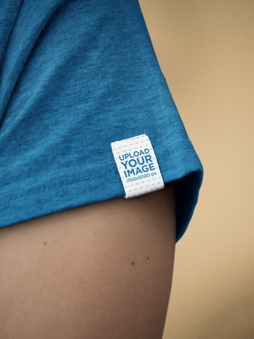 Placeit - Mockup of a Clothing Label on the Sleeve of a Heathered T-Shirt