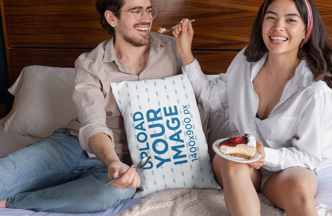 Placeit - Throw Pillow Mockup Featuring a Couple Eating on a Bed