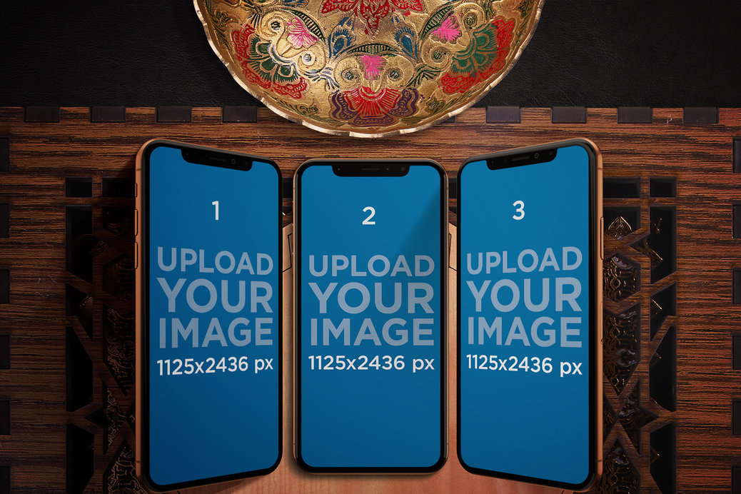 Placeit - Mockup of Three iPhones 11 Pro in an Arabic Setting