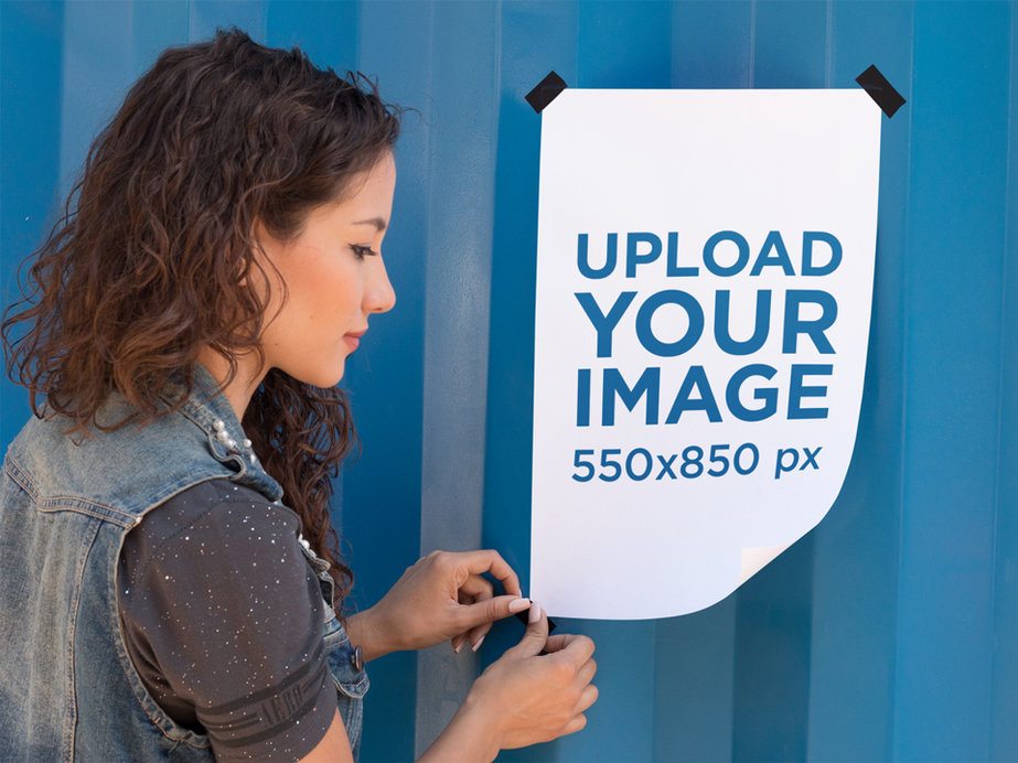 Placeit - Mockup Template of a Woman Taping a Poster to a Wall