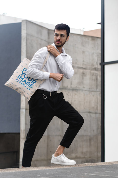 Placeit - Mockup of a Trendy Man with a Tote Bag in the Street