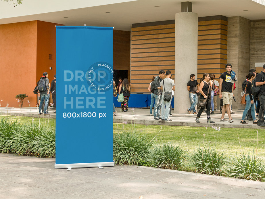 Placeit - Vertical Banner Mockup Outside a Convention Center