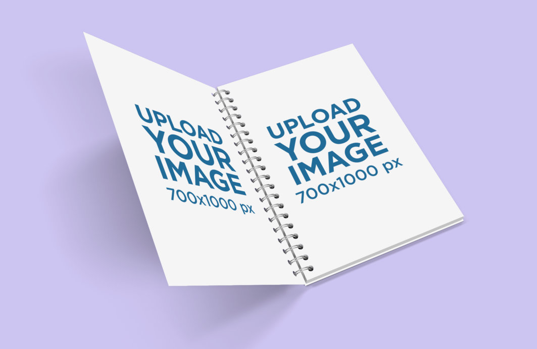 Placeit - Mockup Featuring an Open Spiral Notebook Against a Plain ...
