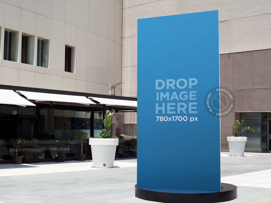 Placeit - Vertical Banner Mockup Outside a Shopping Mall
