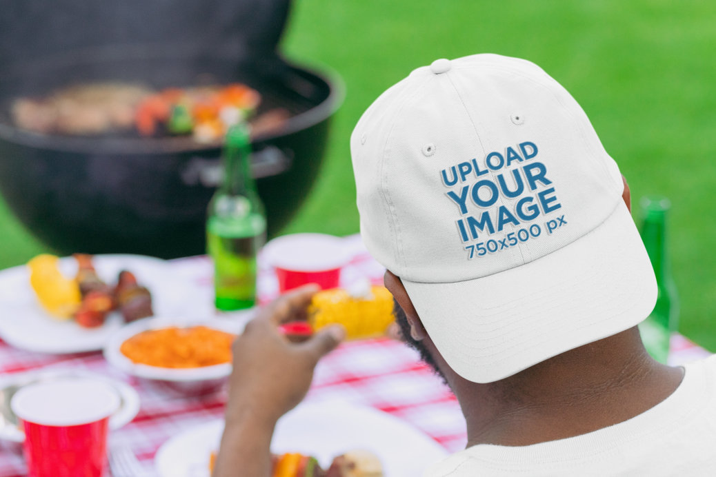 Placeit - Dad Hat Mockup Featuring a Man at a BBQ Party