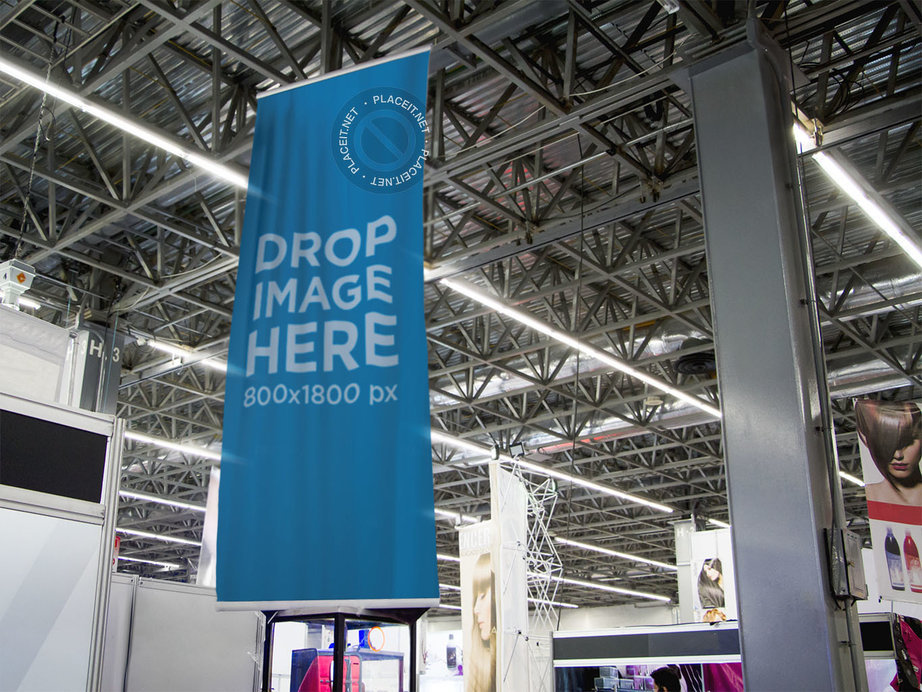 Placeit - Vertical Banner Mockup Hanging From a Ceiling at a Convention ...