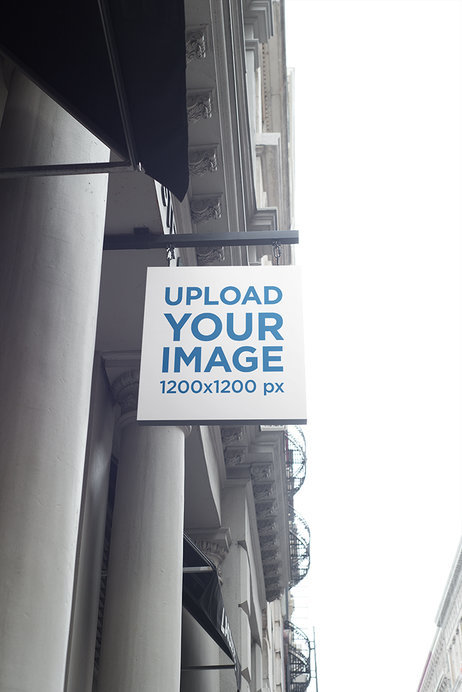Placeit - Squared Shop Sign Mockup at a Classic Building Facade