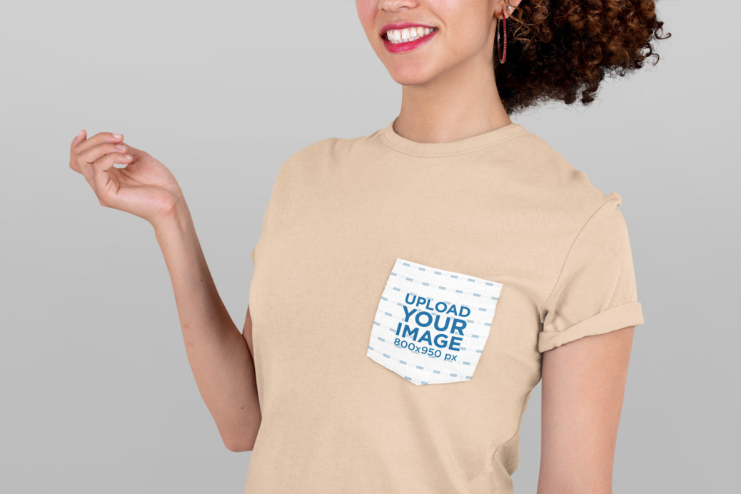 Placeit - Triangle Pocket Tee Mockup of a Woman Smiling at a Studio