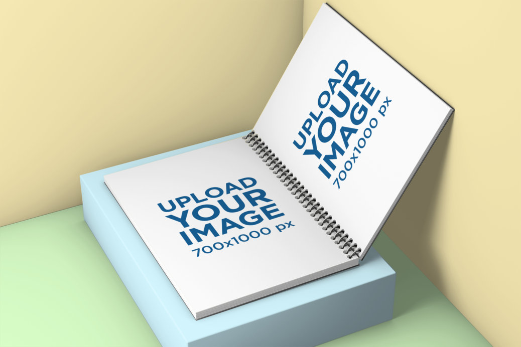 Placeit - Minimal Mockup Featuring an Opened Spiral Notebook