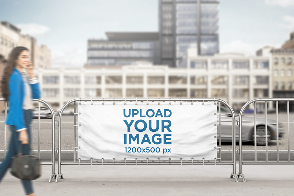 Placeit - Horizontal Banner Mockup of a Barrier Banner at a Busy Street