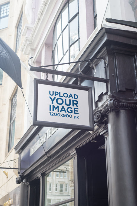Placeit - Mockup of a Rectangular Sign Hanging on a Black-Colored Store