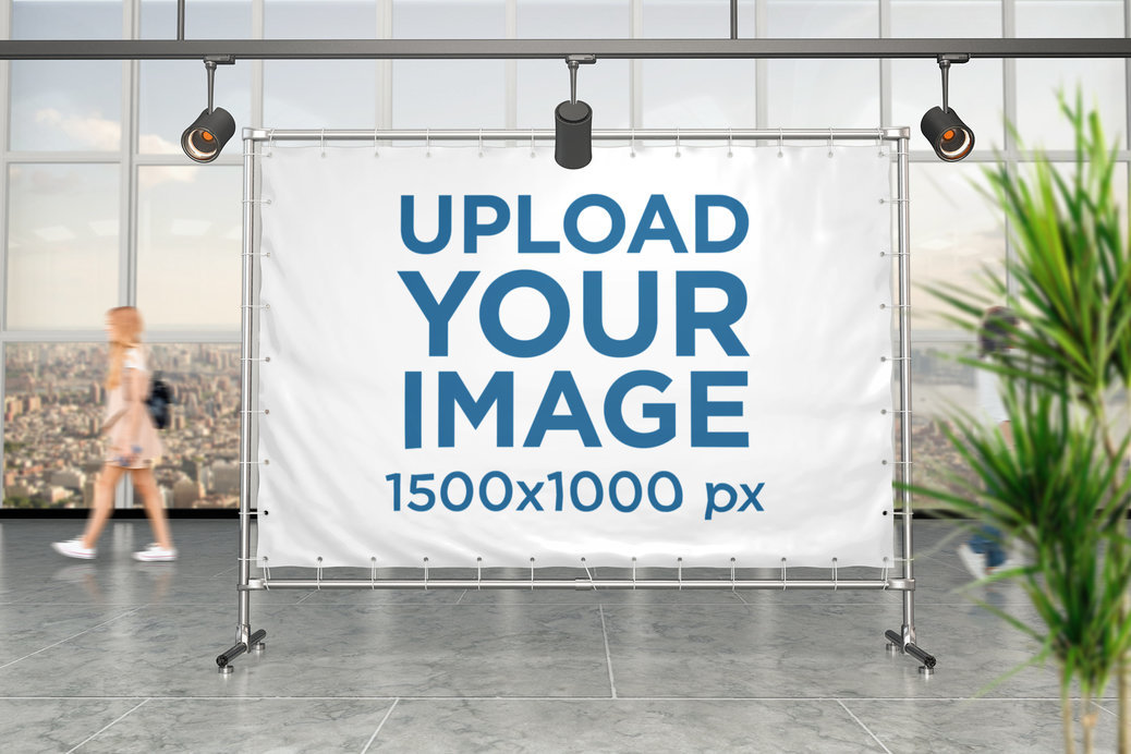 Placeit - Horizontal Banner Mockup Placed Against a Window with a City View