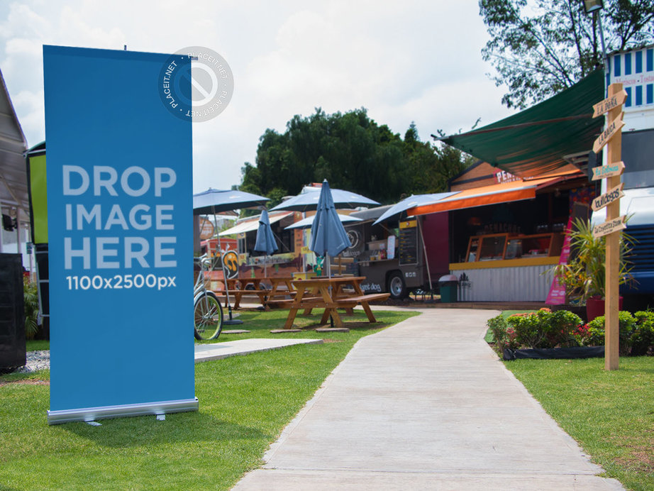 Placeit - Vertical Banner Standing at a Food Truck Park