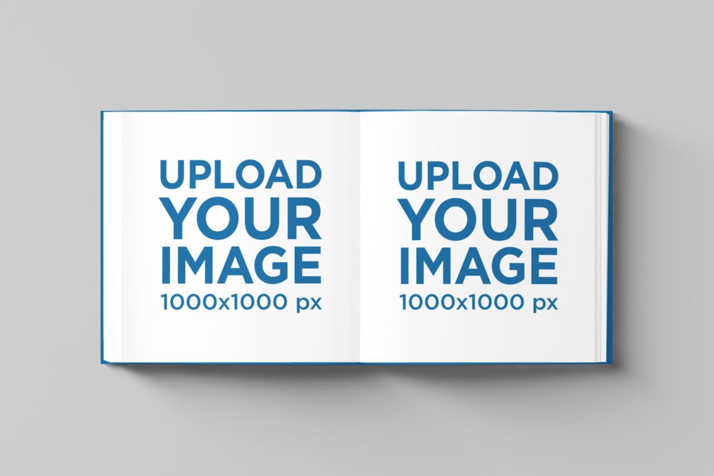 Placeit - Minimal Mockup of an Open Square Book Placed on a Colored Surface