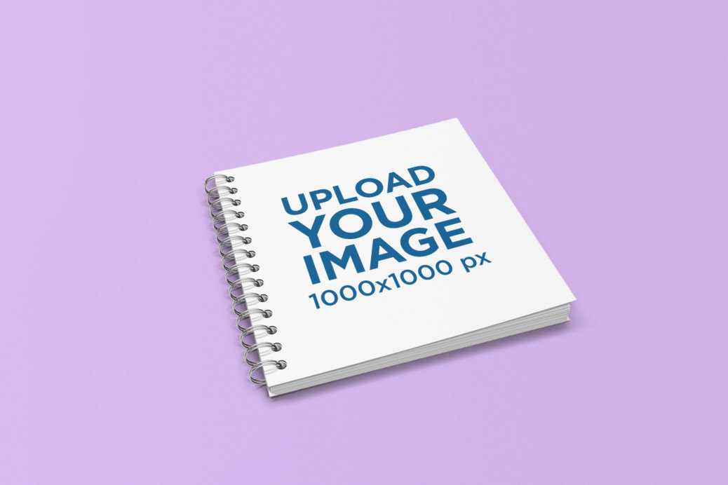 Placeit - Square Notebook Mockup Featuring a Plain Color Surface