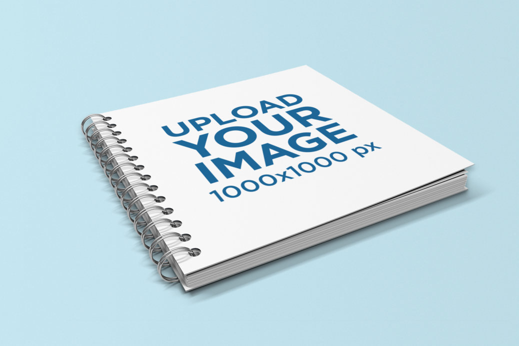Placeit - Mockup of an Angled Squared Notebook with a Spiral Binding