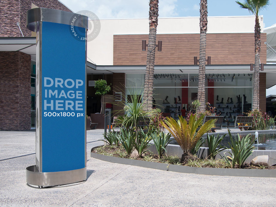 Placeit - Mockup of a Vertical Banner Placed Outside a Mall