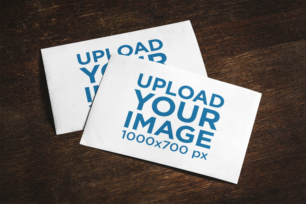 Placeit - Mockup of Two Postcards on a Wooden Surface