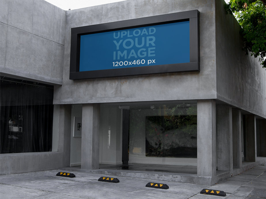 Placeit - Horizontal Banner Mockup Outside a Concrete Building