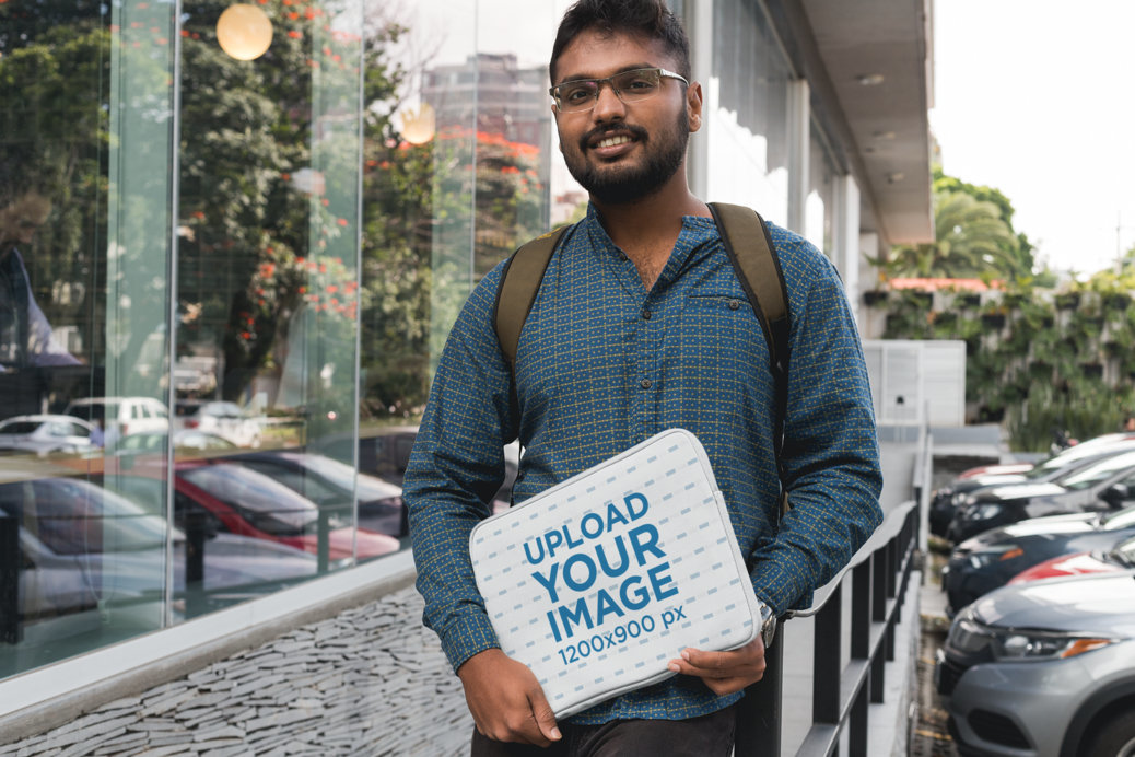 Placeit - Laptop Sleeve Mockup of a Man Carrying a Computer