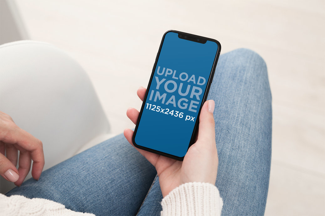 Placeit - Mockup of an iPhone 11 Pro Over the Crossed Legs of a Woman