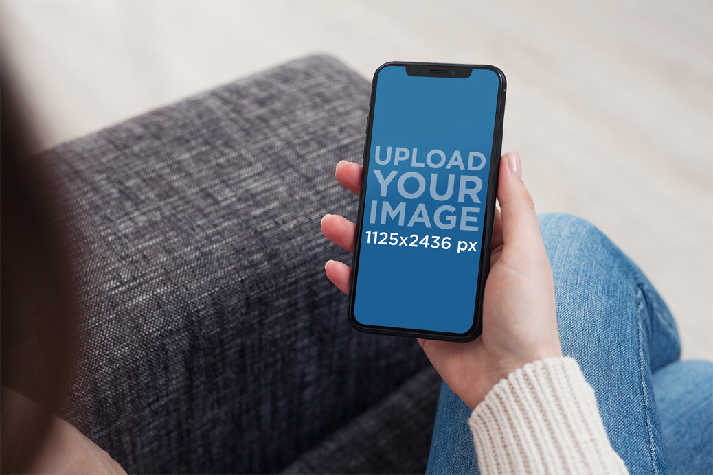 Placeit - iPhone 11 Pro Mockup of a Woman Using Her Phone in a Living Room
