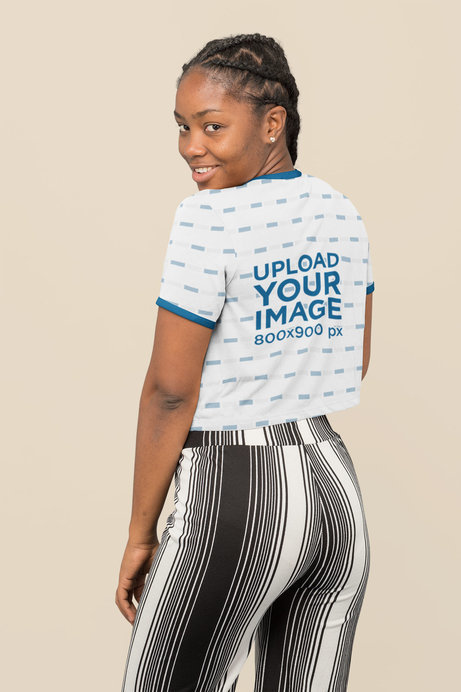Placeit - Back-View Mockup of a Woman Wearing a Sublimated Ringer Crop Top