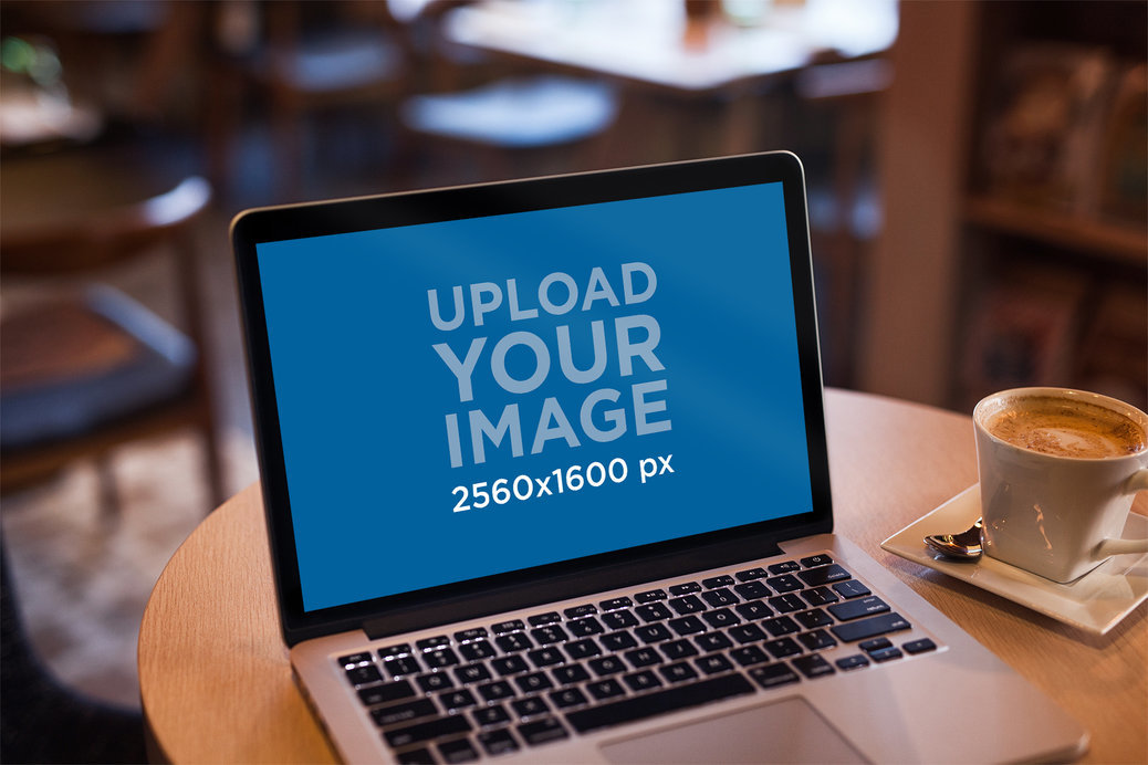 Placeit - Mockup of a MacBook Pro on a Coffee Shop Table
