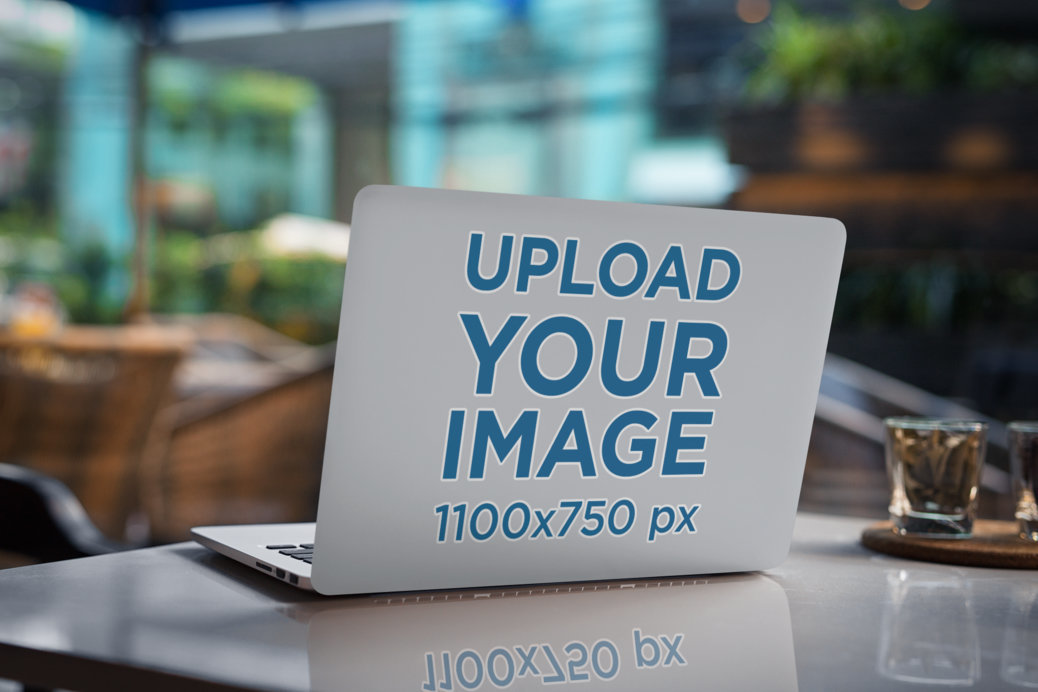 Placeit - Laptop Cover Mockup Featuring a Computer on a Table