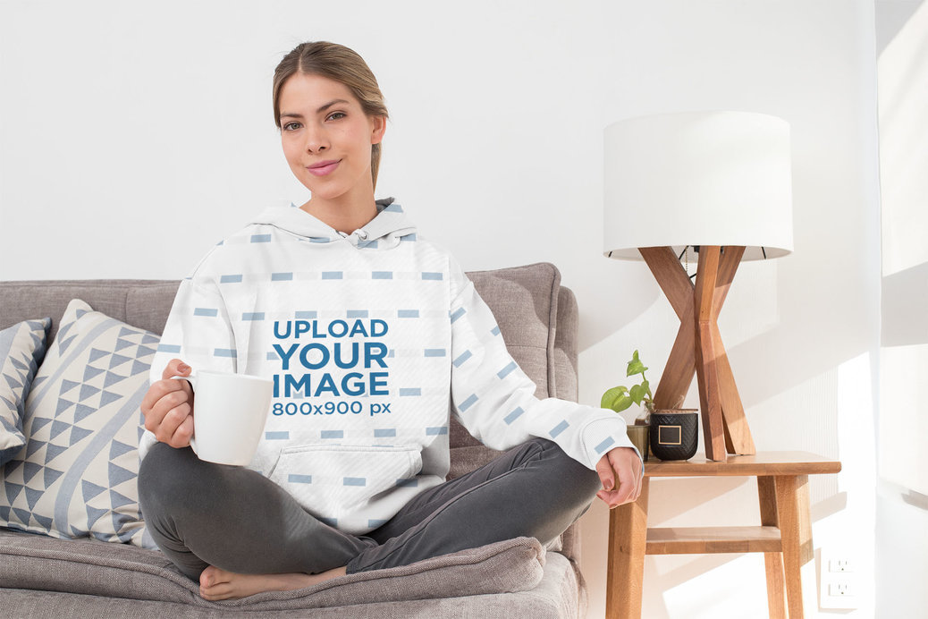 Placeit - Sublimated Pullover Hoodie Mockup Featuring a Woman at Home