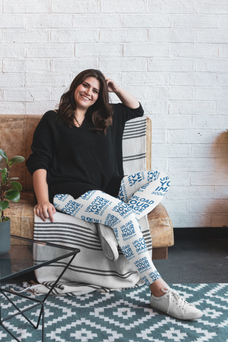 Placeit - Plus Size Leggings Mockup Featuring a Woman Sitting on a Couch