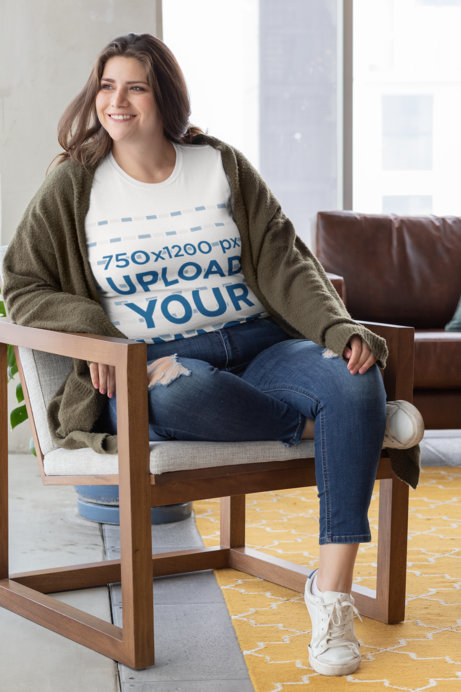 Placeit - Plus Size Tee Mockup Featuring a Woman Sitting on a Home Chair