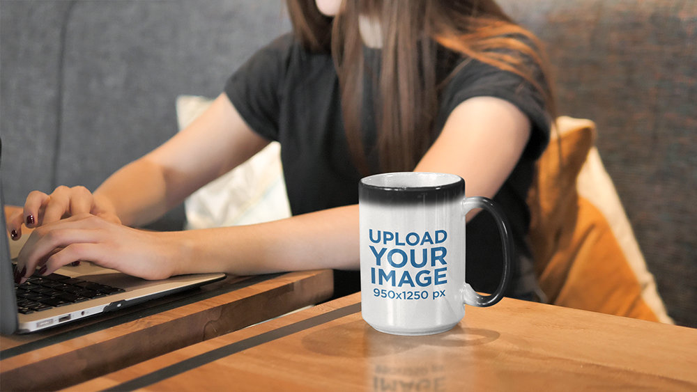 Placeit - 15 oz Coffee Mug Mockup Featuring a Woman Working on Her Laptop
