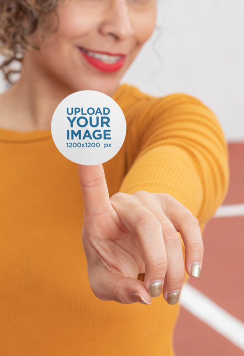 Placeit - Mockup of a Woman Showing Her Round Sticker