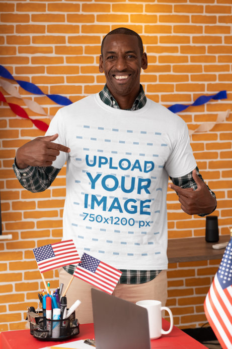 Placeit - Mockup of a Man Pointing at His T-Shirt with a Political Slogan